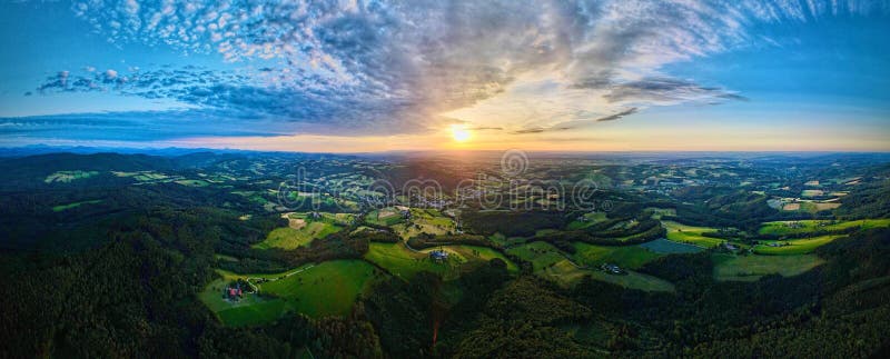 Panoramic View of a Green Landscape with a Beautiful Sunset in the Sky ...