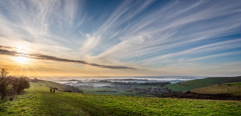 Panoramic View from Hilltop of Sun Setting Over Valley Shrouded in Mist ...