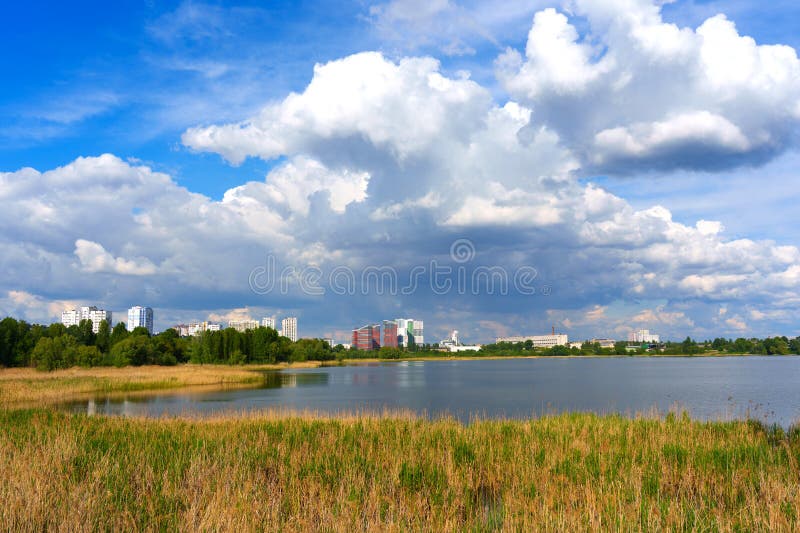 Panoramic View of Lakeside with Urban Skyline and Clouds Stock Photo ...