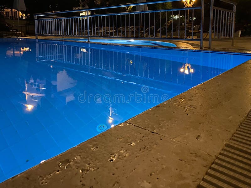 Panoramic View of Luxurious Swimming Pool with Brick Wall and Deck ...