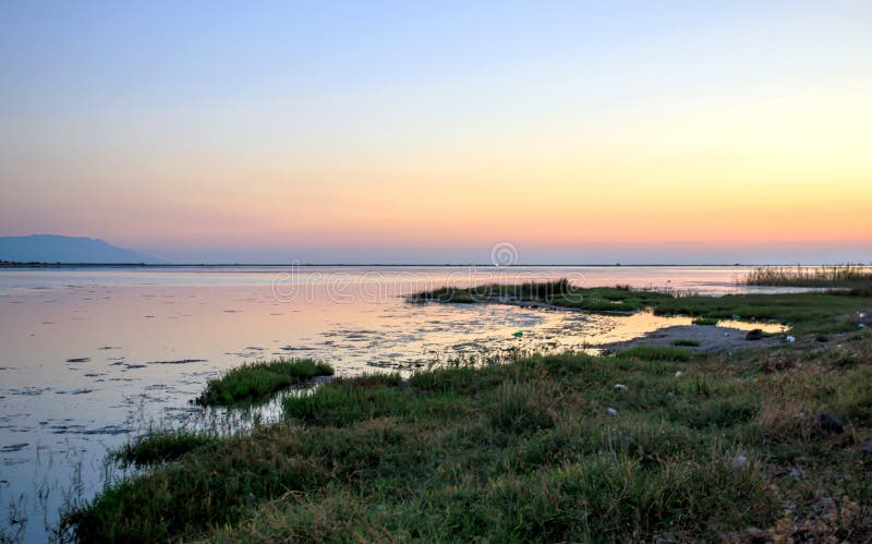 Panoramic View of Magnificent Sunset and Human Garbage on the Beach ...