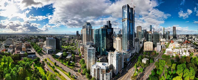 Panoramic View of the Melbourne Skyline with White Floating Clouds ...