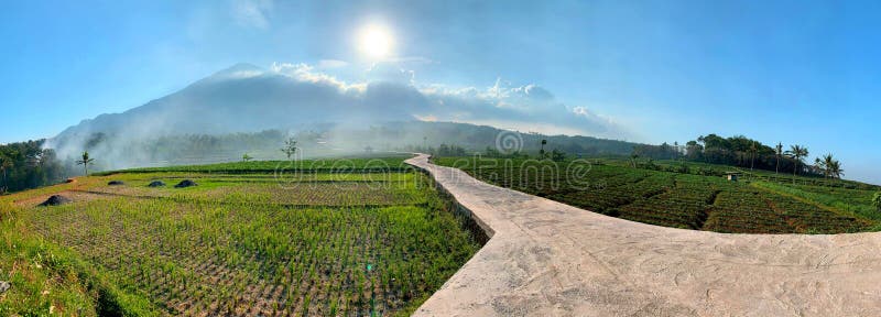 Panoramic View of the Mountain from the Rice Fields with a Winding Road ...
