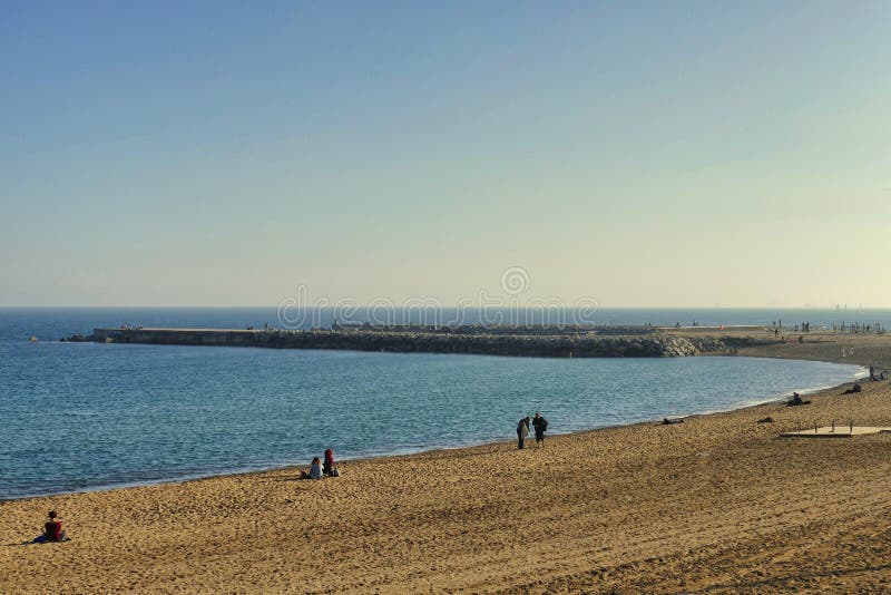 Panoramic View of Sand Beach Inlet and Pier with Few People Stock Photo ...