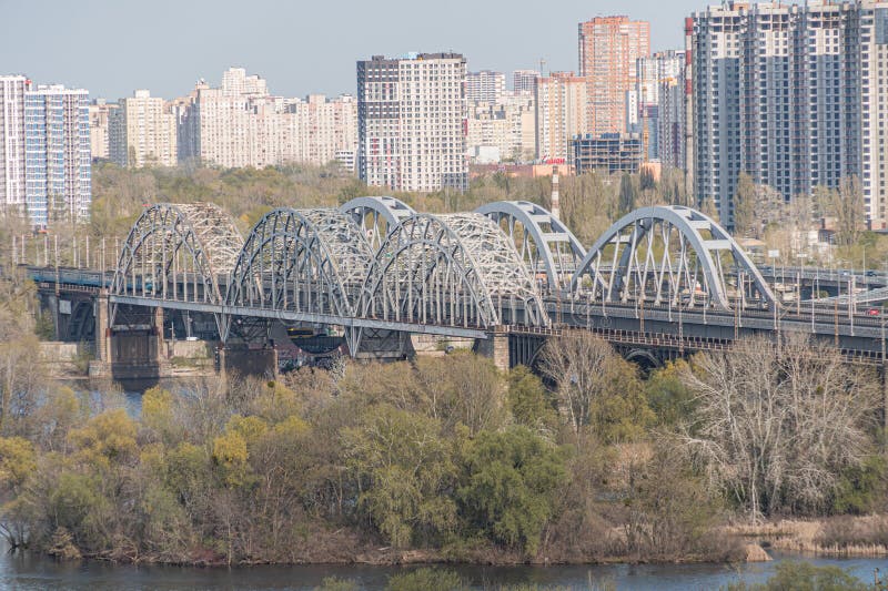 A Panoramic View of a Suspension Bridge Over a River, with Multiple ...