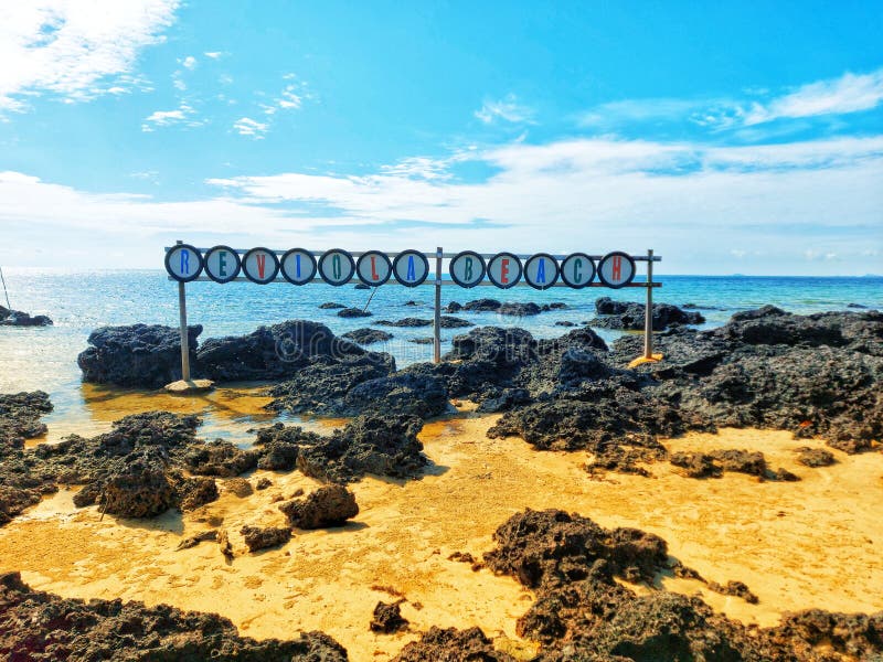 Pantai Reviola Beach stock photo. Image of sand, cloud - 200974314