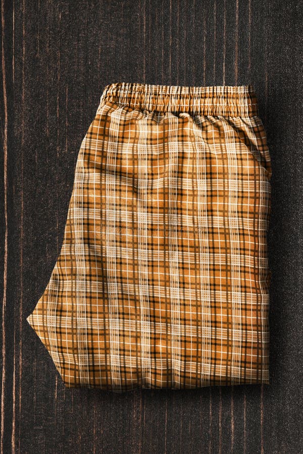 Pants on wooden background stock image. Image of floor - 128859491