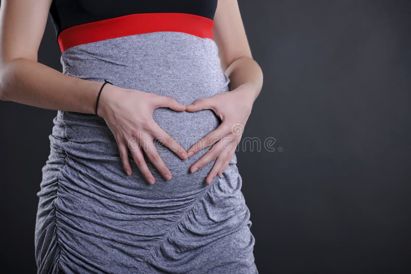 Panza embarazada imagen de archivo. Imagen de tacto, embarazo - 23569775