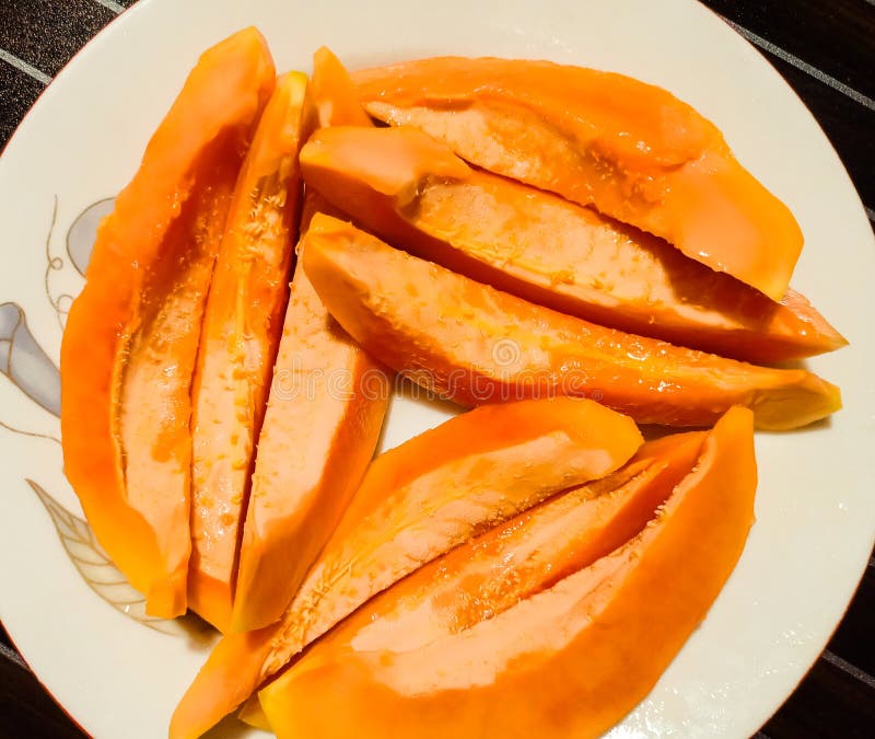 Papaya slices in a dish. stock photo. Image of salad - 175712336