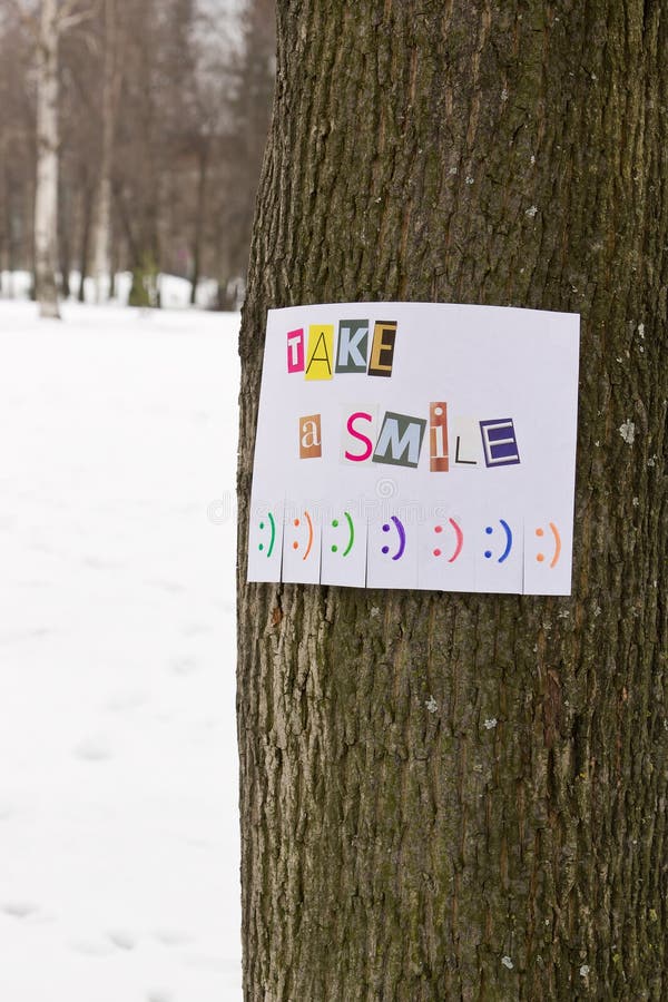 A Paper Ad with the Phrase: Take a Smile and with Smile Signs. Stock ...