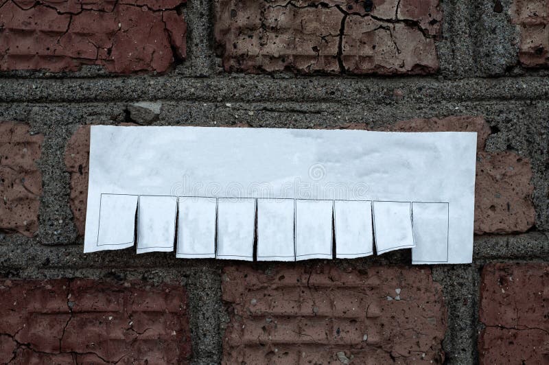 Paper Advertisement without Text Pasted on the Old Brick Wall Stock ...
