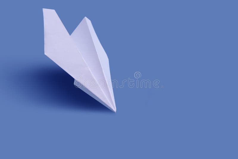 Paper Airplane on a Blue Paper Background Stock Image - Image of page ...