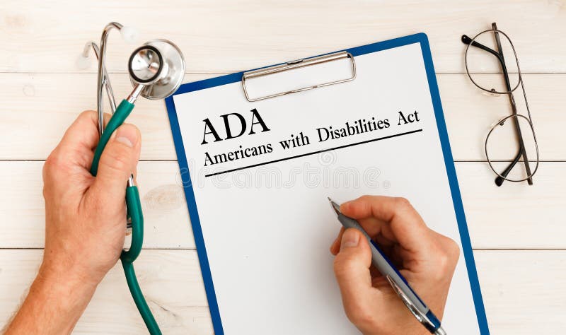 Paper with Americans with Disabilities Act ADA on the Table Stock Photo ...