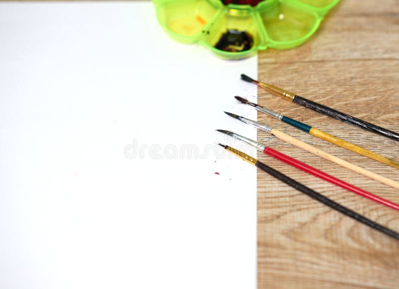 Paper of Art Work with Color Plate and Color Brushes, Side View Stock ...