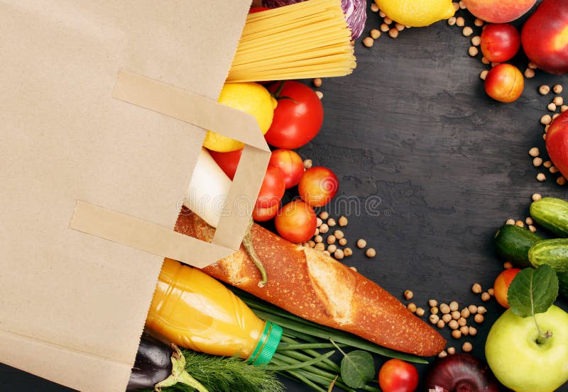 Paper Bag with Food on Dark Surface with Copy Space Stock Photo - Image ...