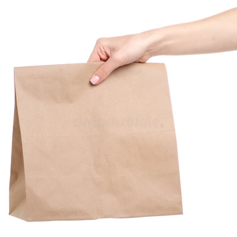 Paper bag package in hand stock photo. Image of marketing - 132458360