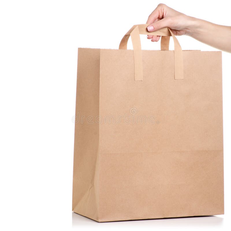 Paper bag package in hand stock photo. Image of meal - 132297422