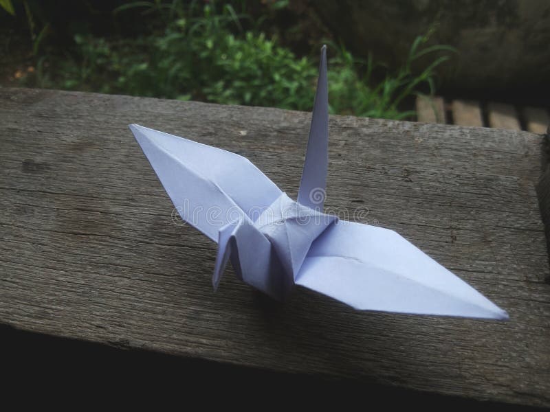 Paper bird on the ground stock photo. Image of beautiful - 315434094