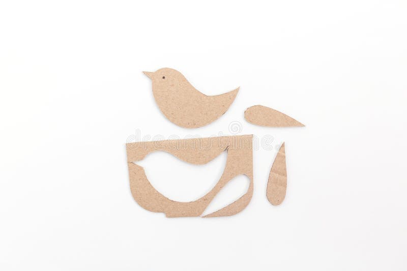 A Paper Birds Sitting on Top of a Table, Cut Out of Cardboard Stock ...