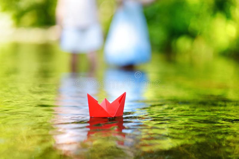 A Paper Boat Floating on a River Stock Image - Image of background ...