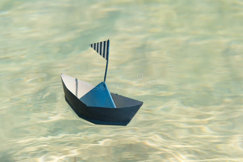 Paper Boat Floating on Water Stock Photo - Image of water, color: 177300866