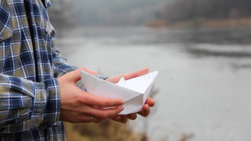 Paper Boat in Hands on a Background of Water Stock Footage - Video of ...