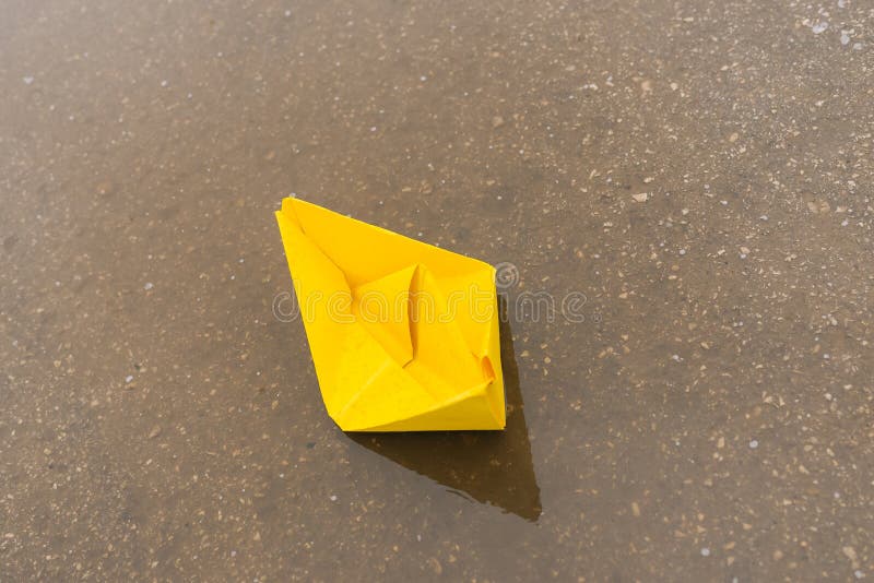Paper boat in a puddle stock image. Image of family - 115486709