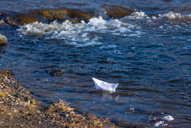 A Paper Boat on a Turbulent Stream of Water Struggles with the Flow ...