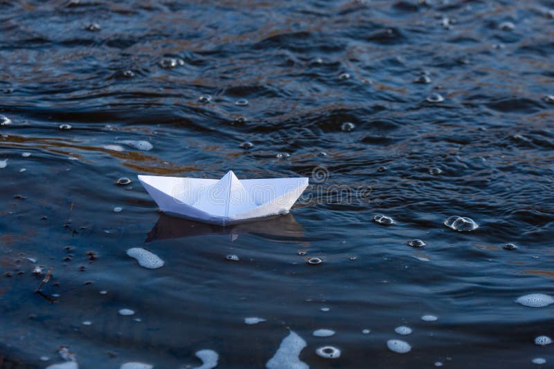 A Paper Boat on a Turbulent Stream of Water Struggles with the Flow ...