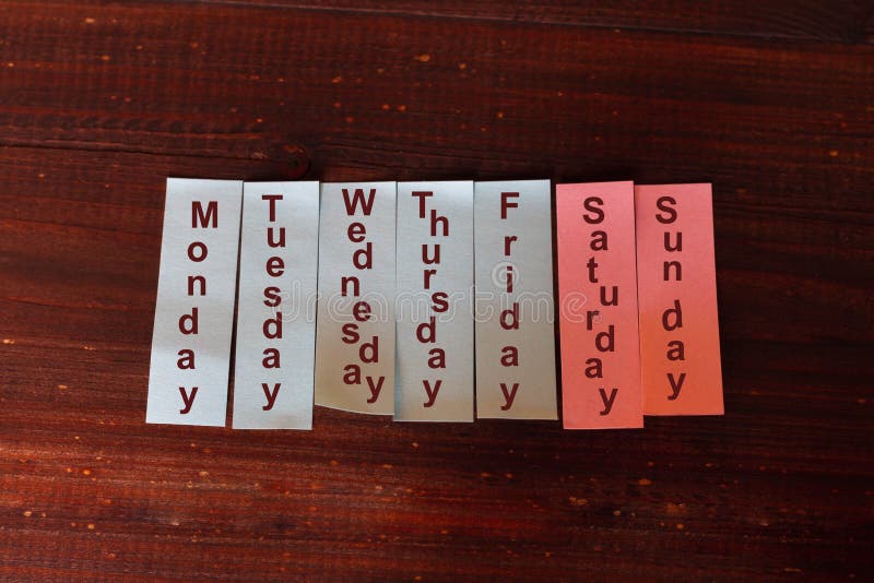 Paper Bookmarks with the Names of Days of the Week on the Table ...