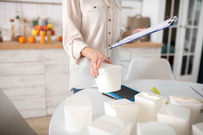 Paper Box in a Female Hand Over the Table. Stock Photo - Image of ...