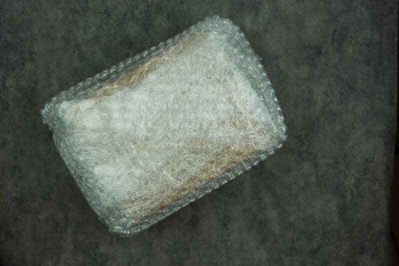 Paper Box Wrapped in Plastic Bubble Wrap Stock Photo - Image of gift ...