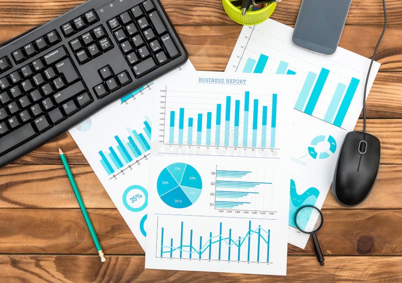 Paper Business Graphs at Office Workplace. Business Research and Report ...