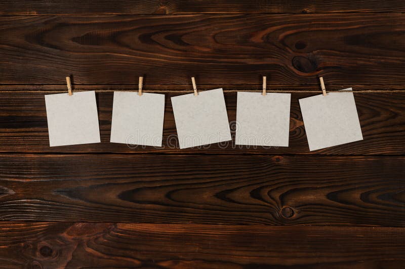 Paper Cards Hanging on the Rope on Wooden Background Stock Photo ...