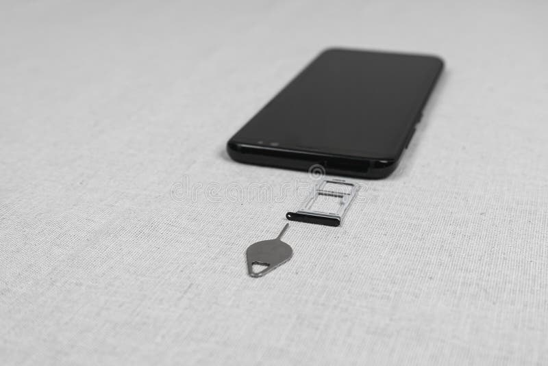 Paper Clip and Sim Card Tray of Smartphone Stock Photo - Image of phone ...