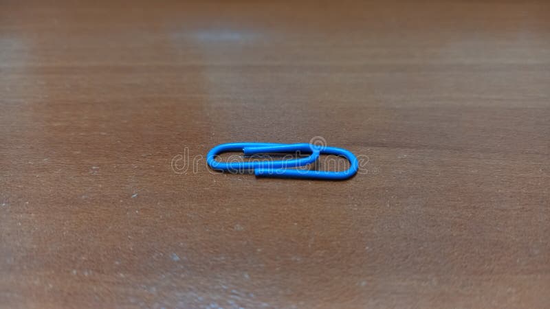 Paper clip on the table stock photo. Image of organ - 268168798