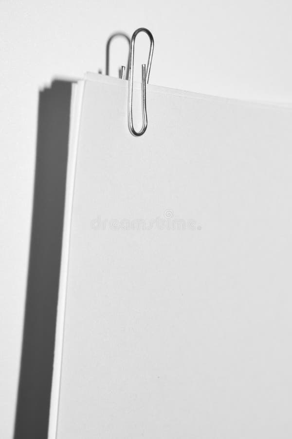 Clip on sheets of paper stock photo. Image of paper - 149249254