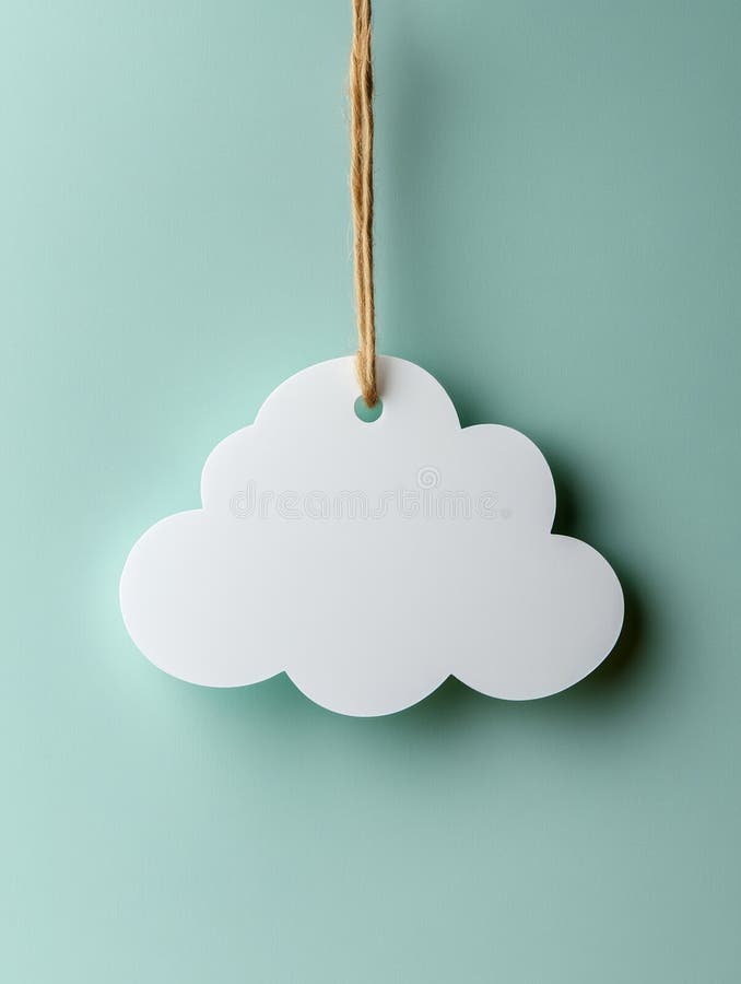 Paper Cloud Cutout Hanging on a String with Green Backdrop Stock Image ...