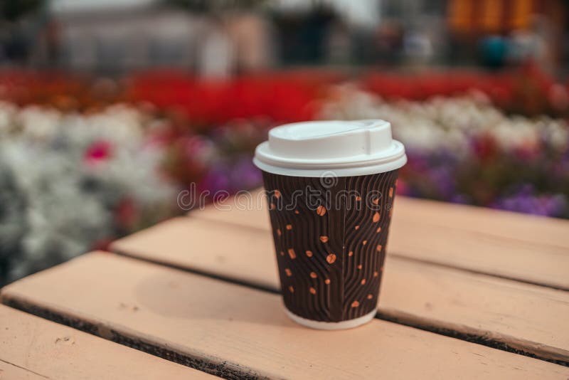 Paper Coffee Cup on Wooden Table in Outdoor Cafe. Stock Photo - Image ...