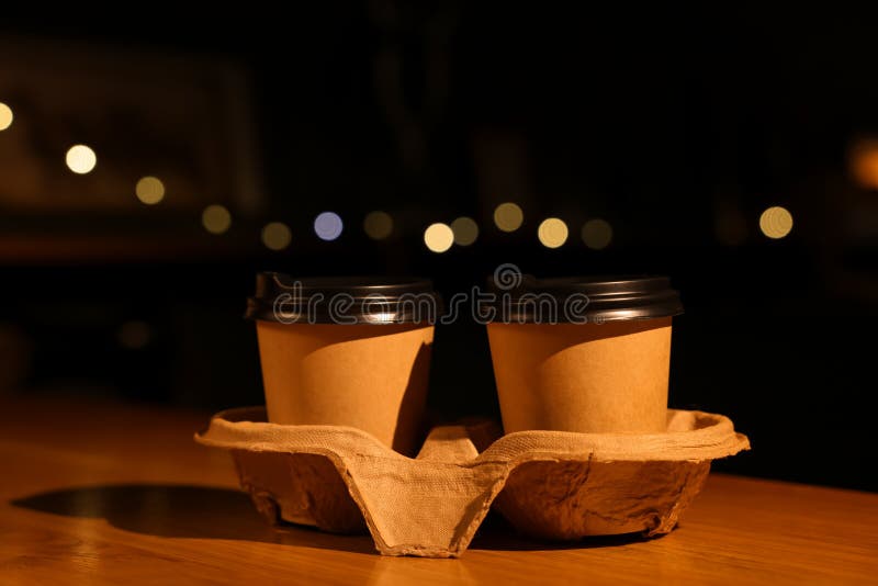 Paper Coffee Cups on Wooden Table in Cafe Stock Image - Image of bokeh ...