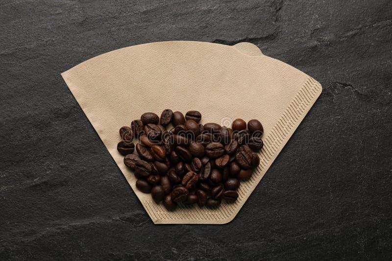 Paper Coffee Filter and Beans on Black Table, Top View Stock Photo ...