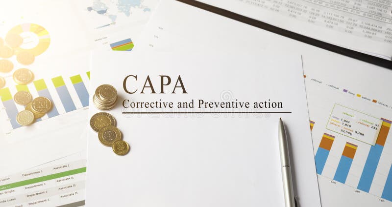 Corrective and Preventive CAPA Action Plans on a Table Stock Photo ...
