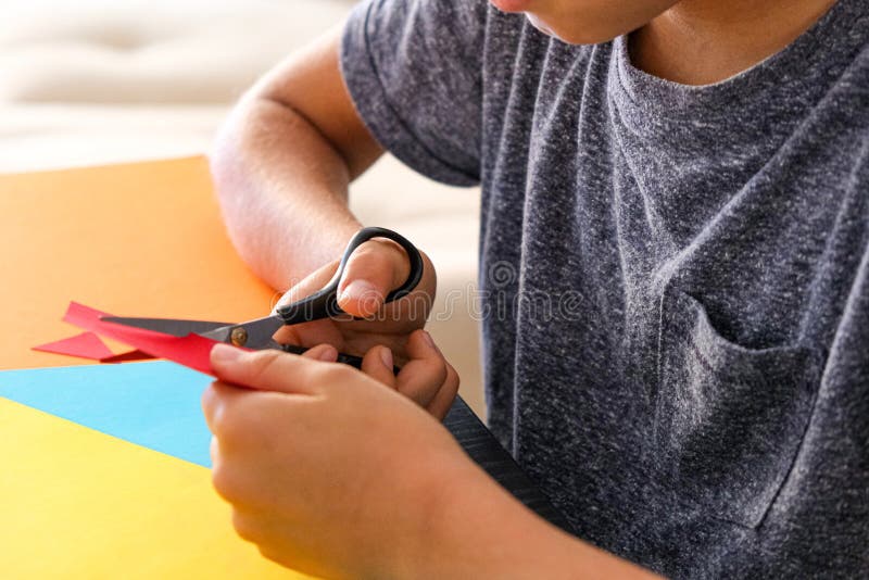 Paper Crafts for Kids. Child Hands Cutting Colored Paper with Scissors ...