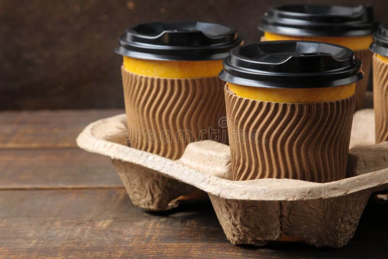 Paper Cups with Coffee on a Stand on a Brown Table. Stock Image - Image ...