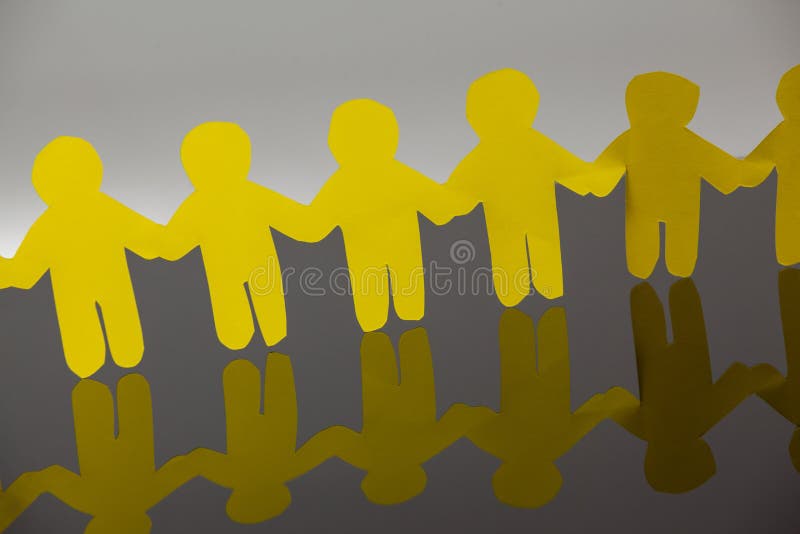 Paper Cut Outs Forming a Human Chain Stock Image - Image of human ...
