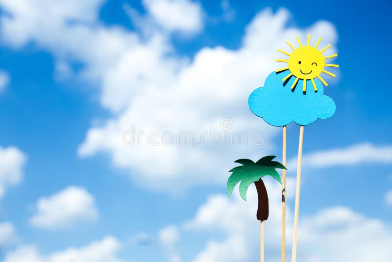 Paper Cut Palm Tree, Winking Sun and Cloud on Sticks Stock Photo ...