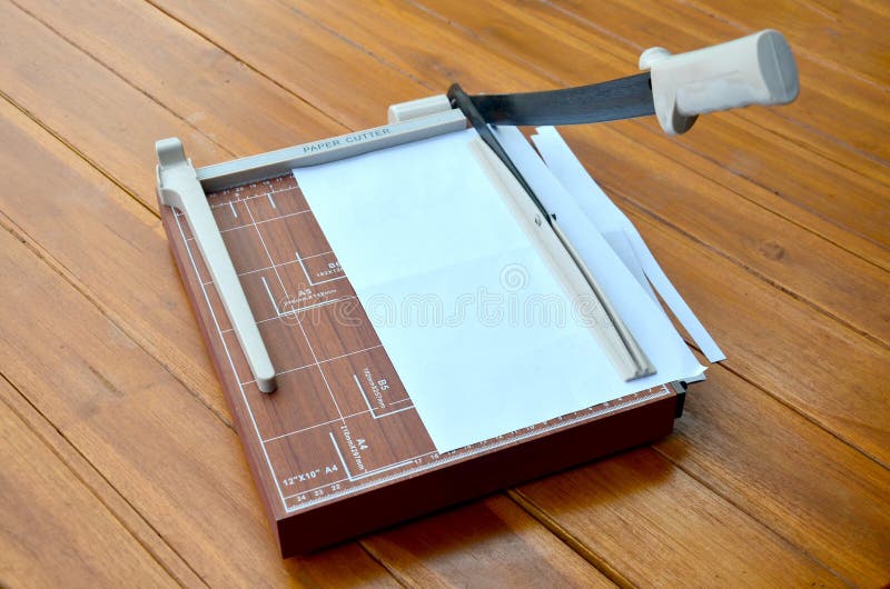 Paper Cutter cutting paper stock image. Image of crop - 67149213