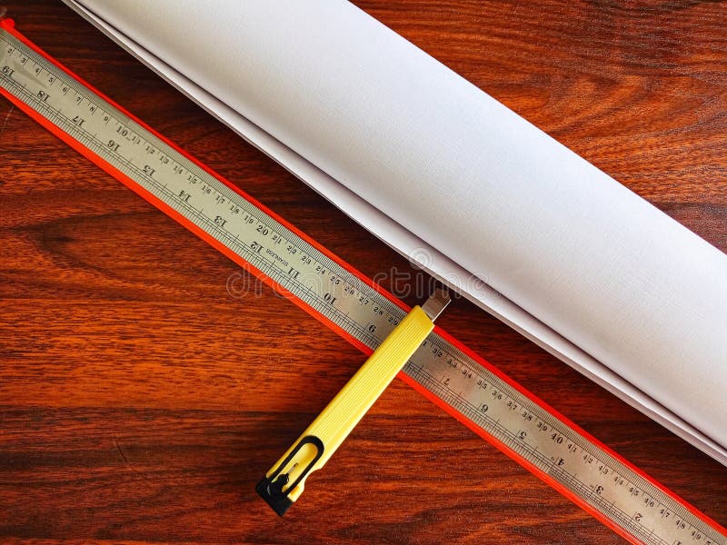 Paper, Cutter and Ruler on the Work Table Stock Image - Image of ...
