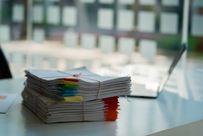 Paper Documents Stacked on a Wooden Table at Work. Business Idea Laptop ...