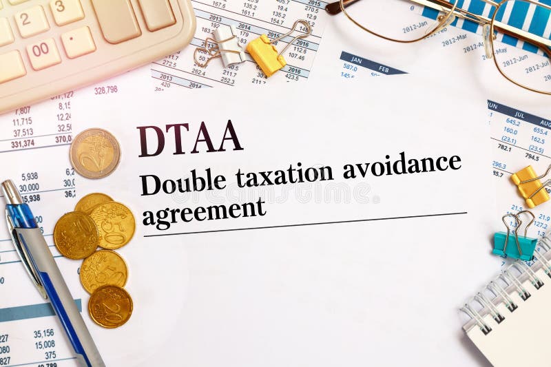 Paper with DTAA Double Taxation Avoidance Agreement on the Table ...